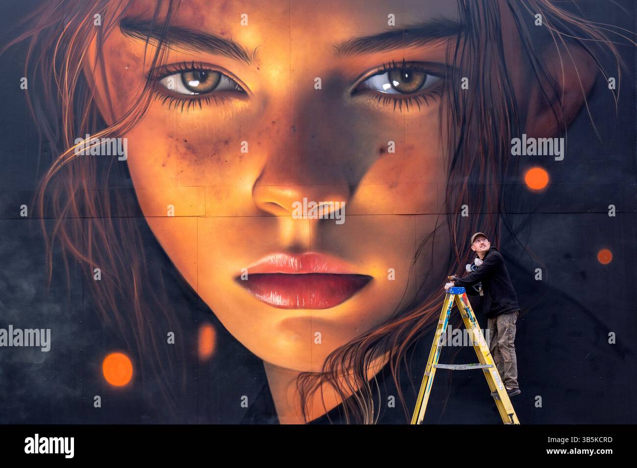 Artist 'Jeks', who has travelled from North Carolina in the United ...