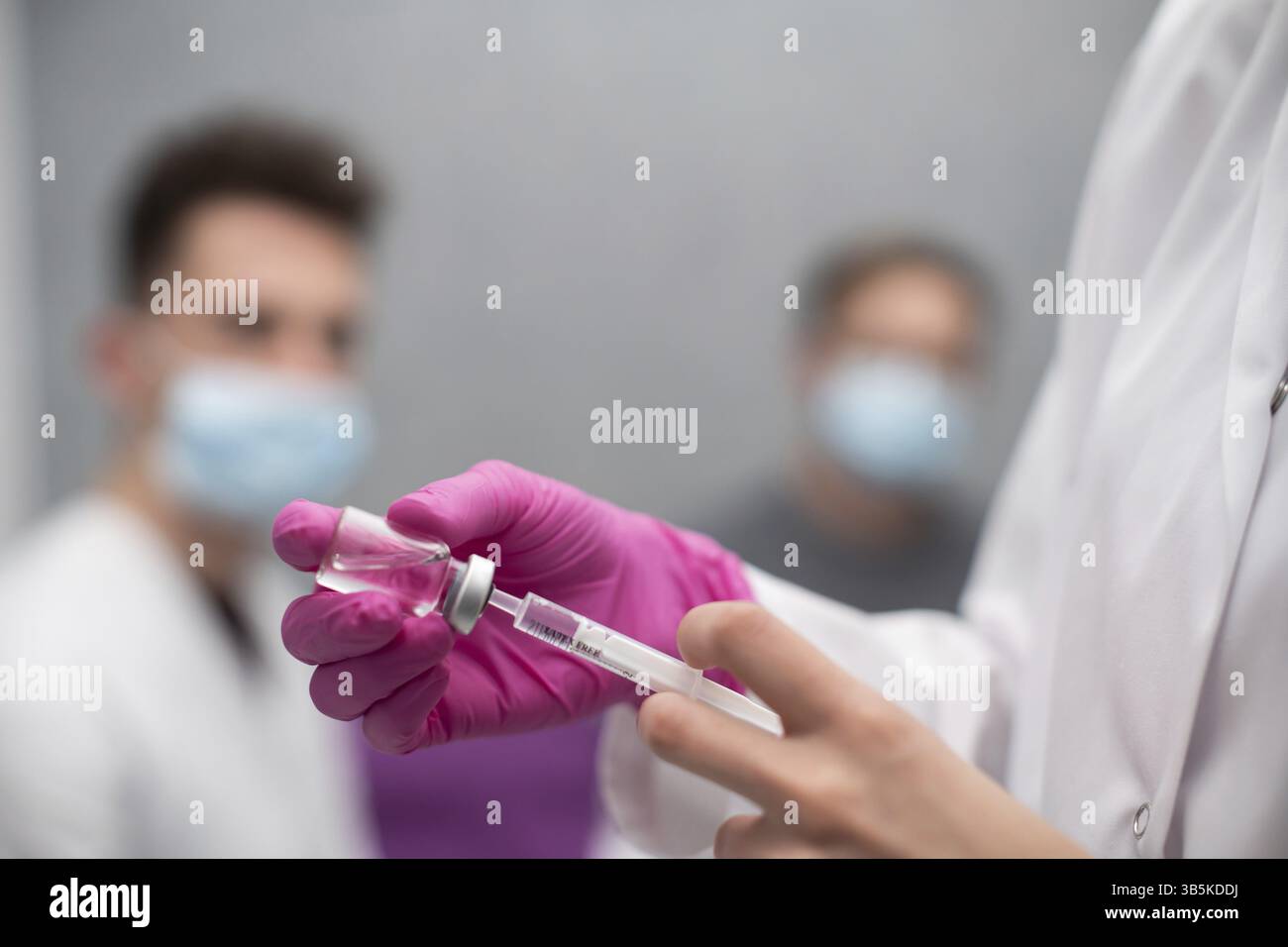 In a practical lesson, a young nurse shows medical trainees how to ...