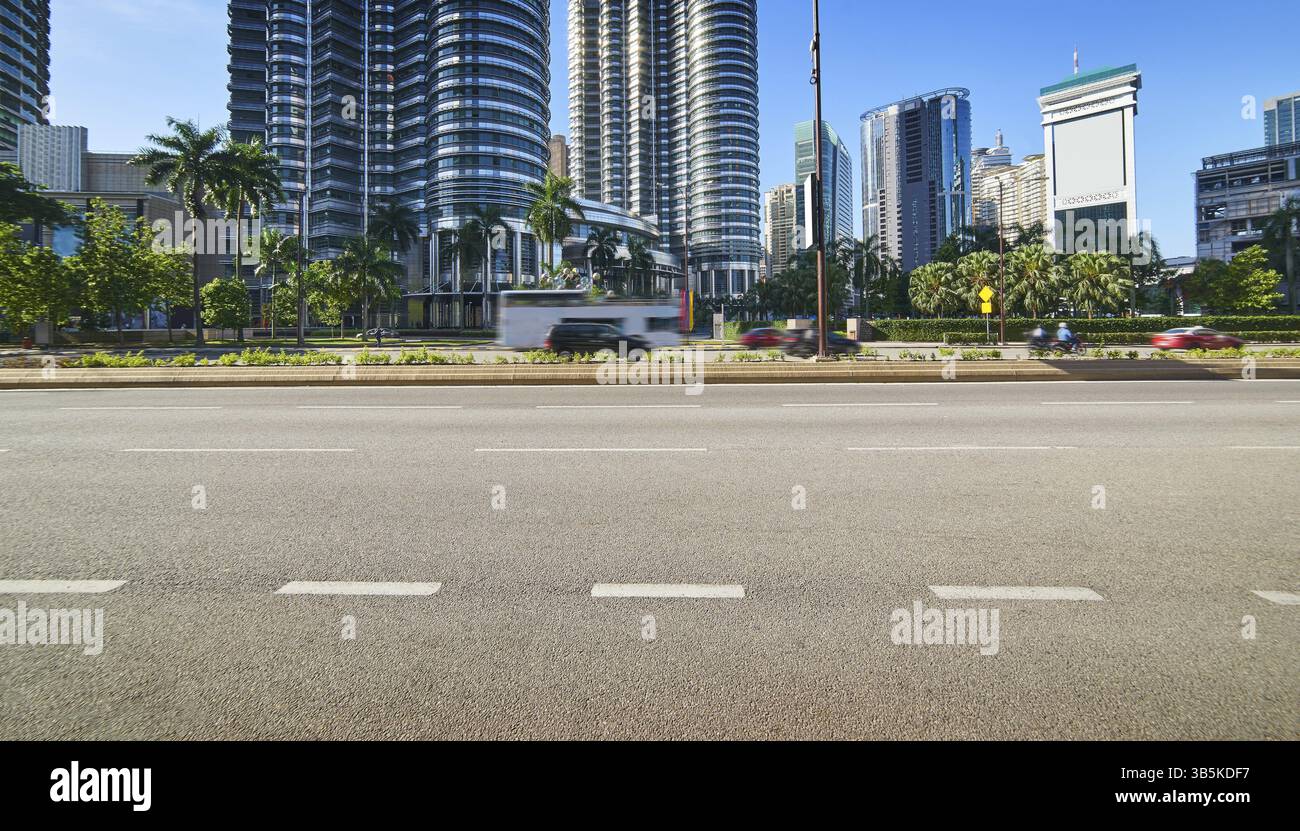 Empty asphalt road and modern buildings in Kuala Lumpur, Malaysia, Asia ...