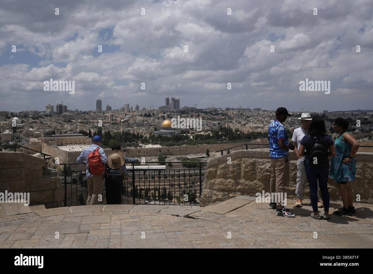 Visitors overlook the Dome of the Rock Mosque in the Al-Aqsa Mosque ...