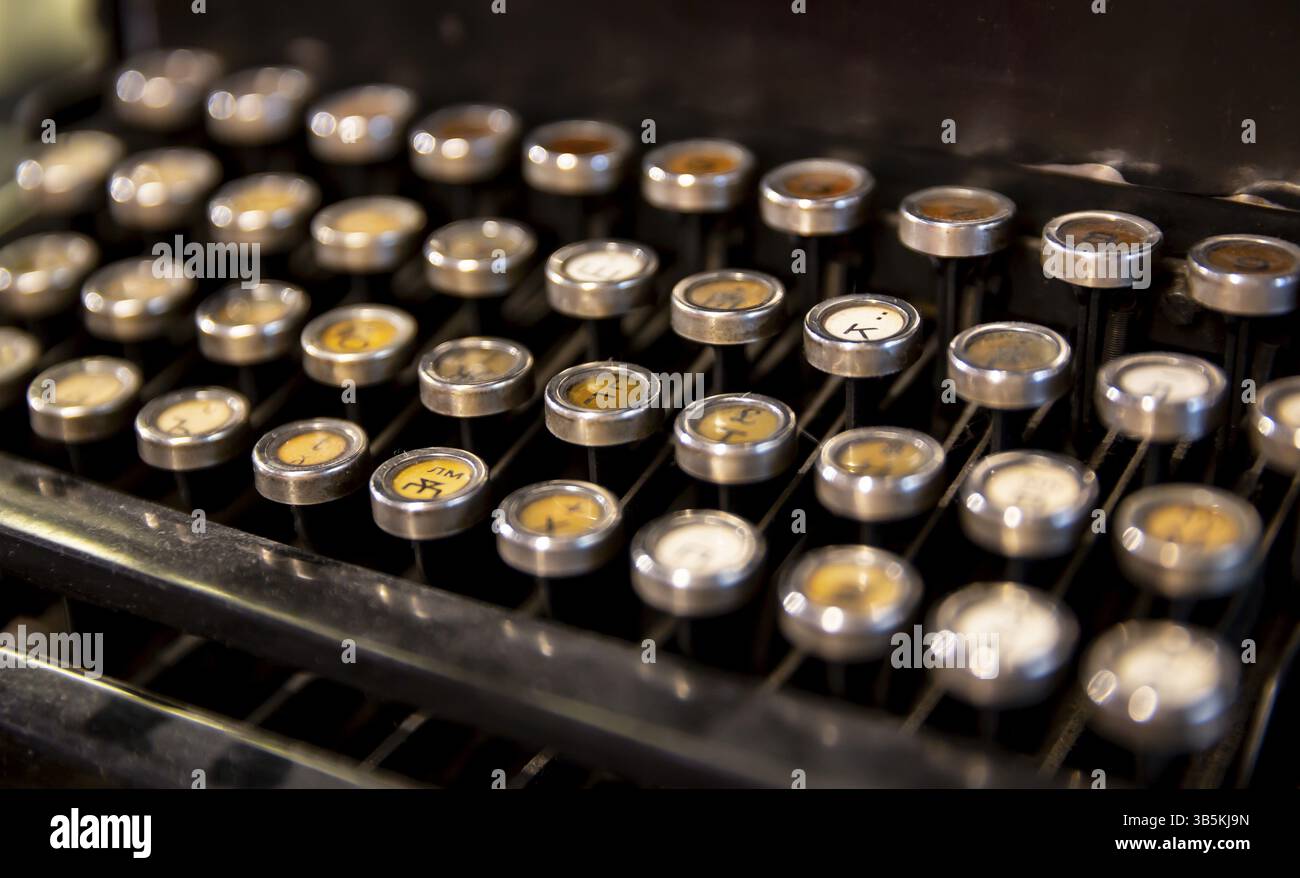 Details of an old fashioned typewriting machine. A typewriter is a ...