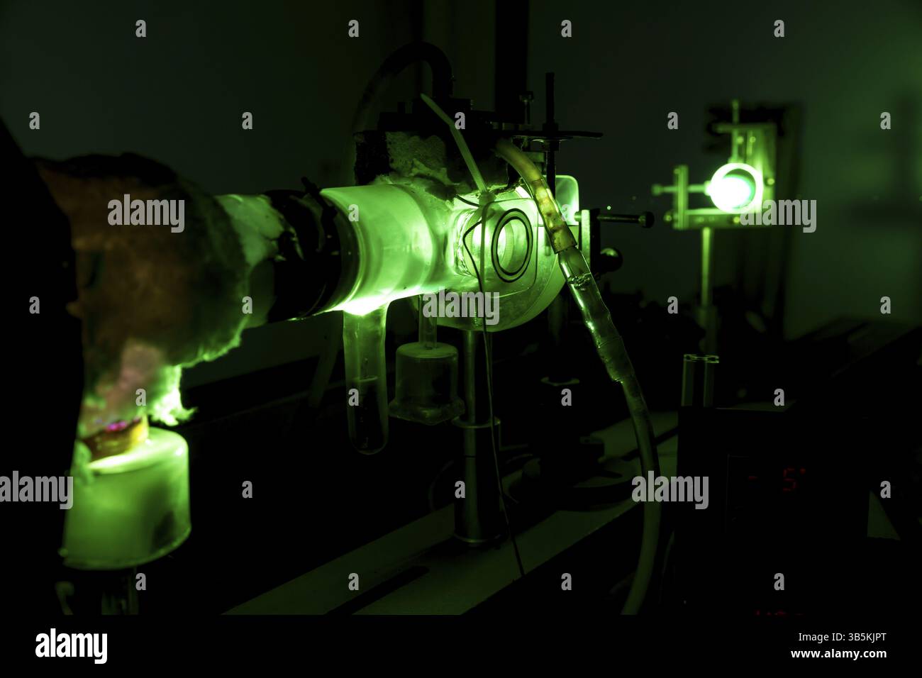 Powerful industrial green laser equipment in a laboratory for physics ...