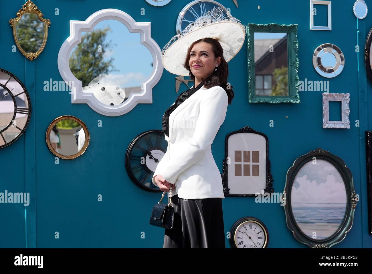 Racegoer Elena Sochina poses for photos on day four of the Punchestown ...