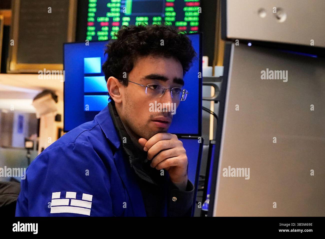Specialist Alex Weitzman works at his post on the floor of the New York ...