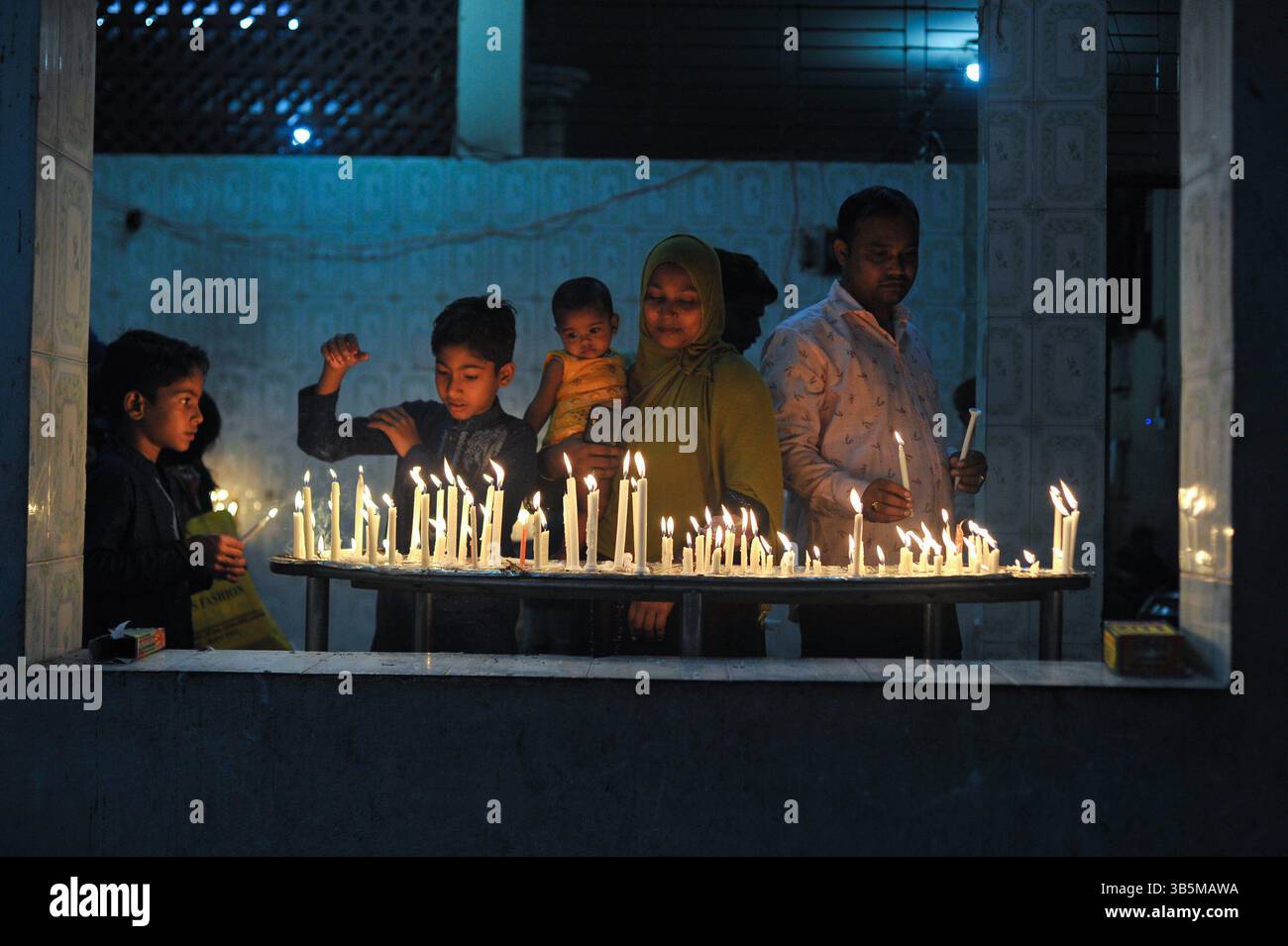 August 5, 2022: Sylhet, Bangladesh: Devotees are lighting the candle at ...
