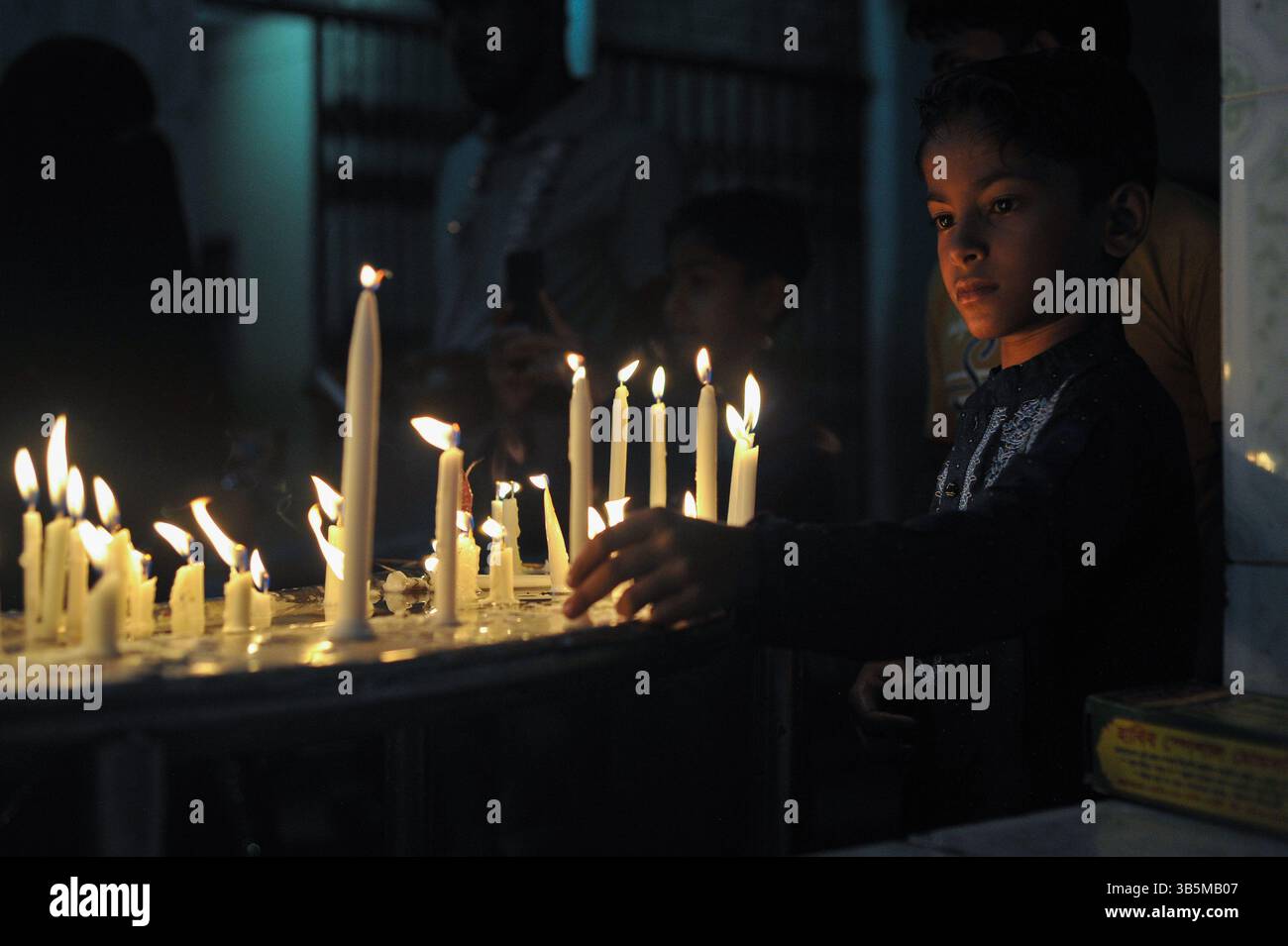 August 5, 2022: Sylhet, Bangladesh: Devotees are lighting the candle at ...