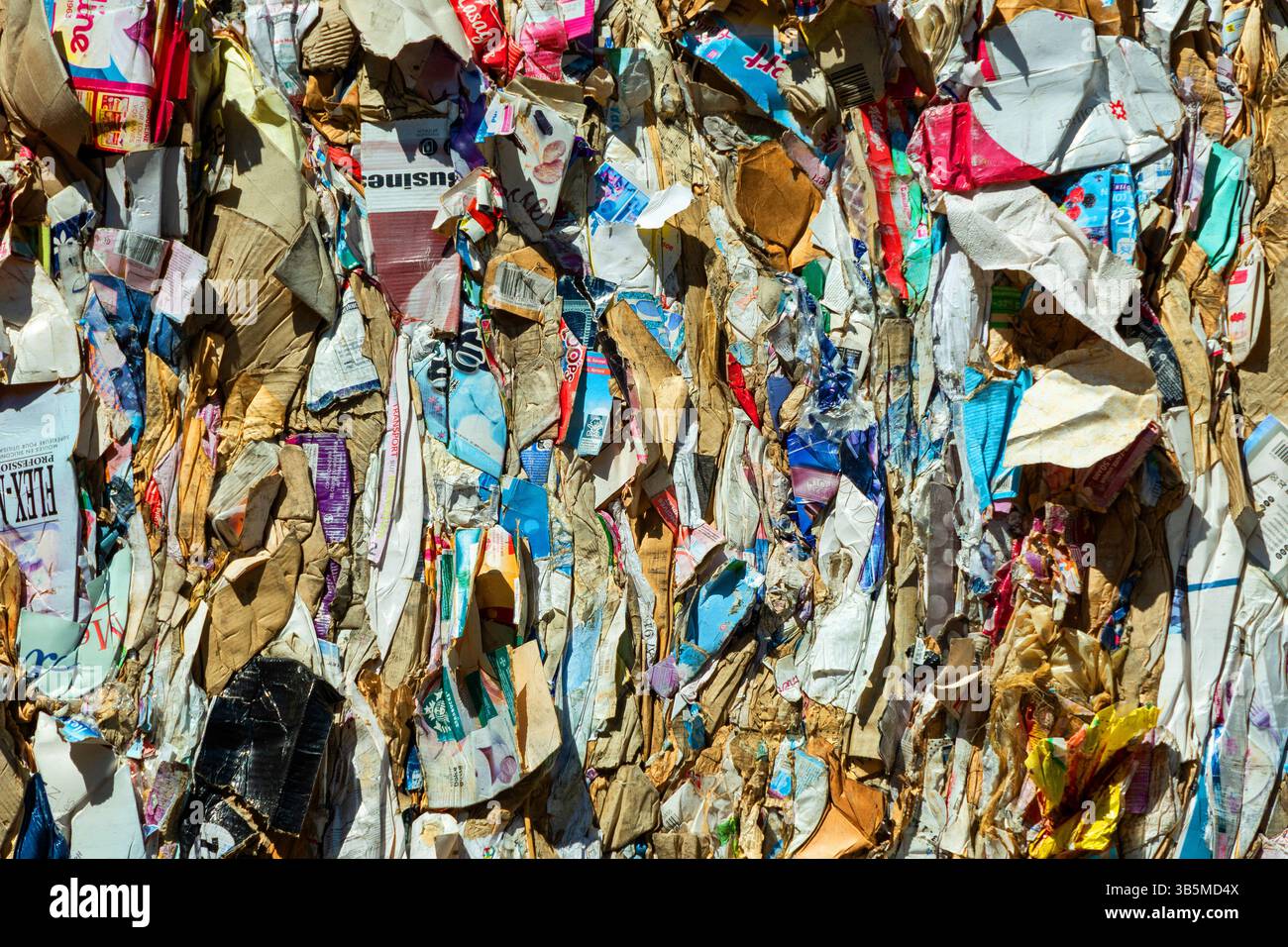Compressed waste papers stacked together illustrate the recycling ...