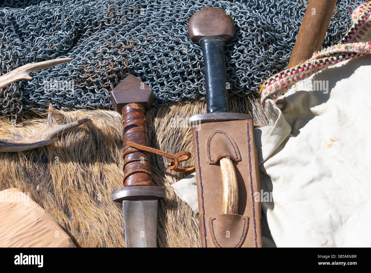 Medieval armory: ancient swords on chainmail and fur display Stock ...