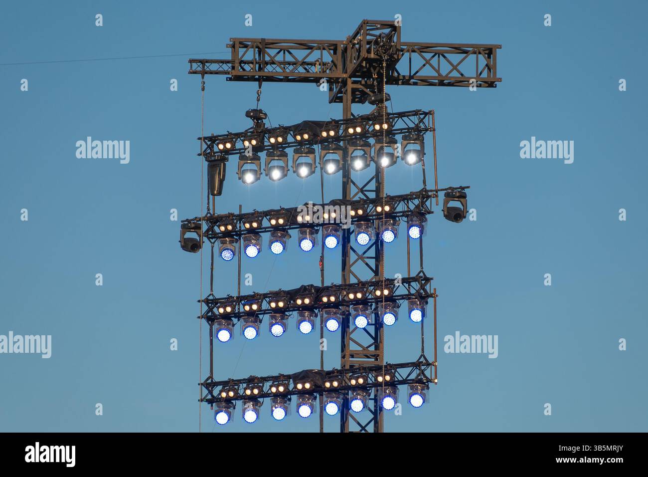 Outdoor concert stage lighting rigs against clear blue sky Stock Photo ...