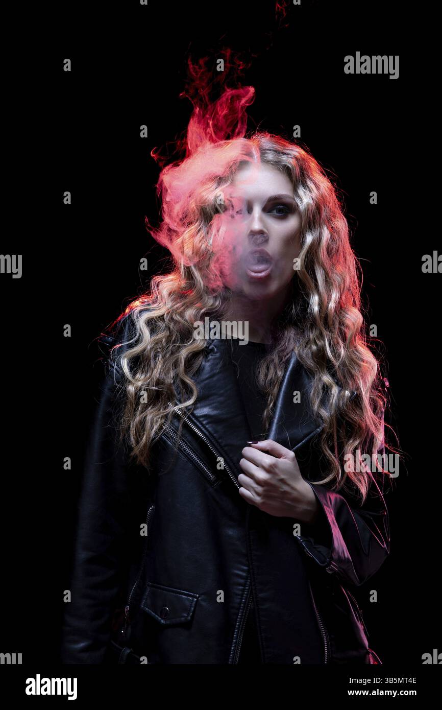 A dramatic portrait showcases an edgy style with dynamic smoke effects ...