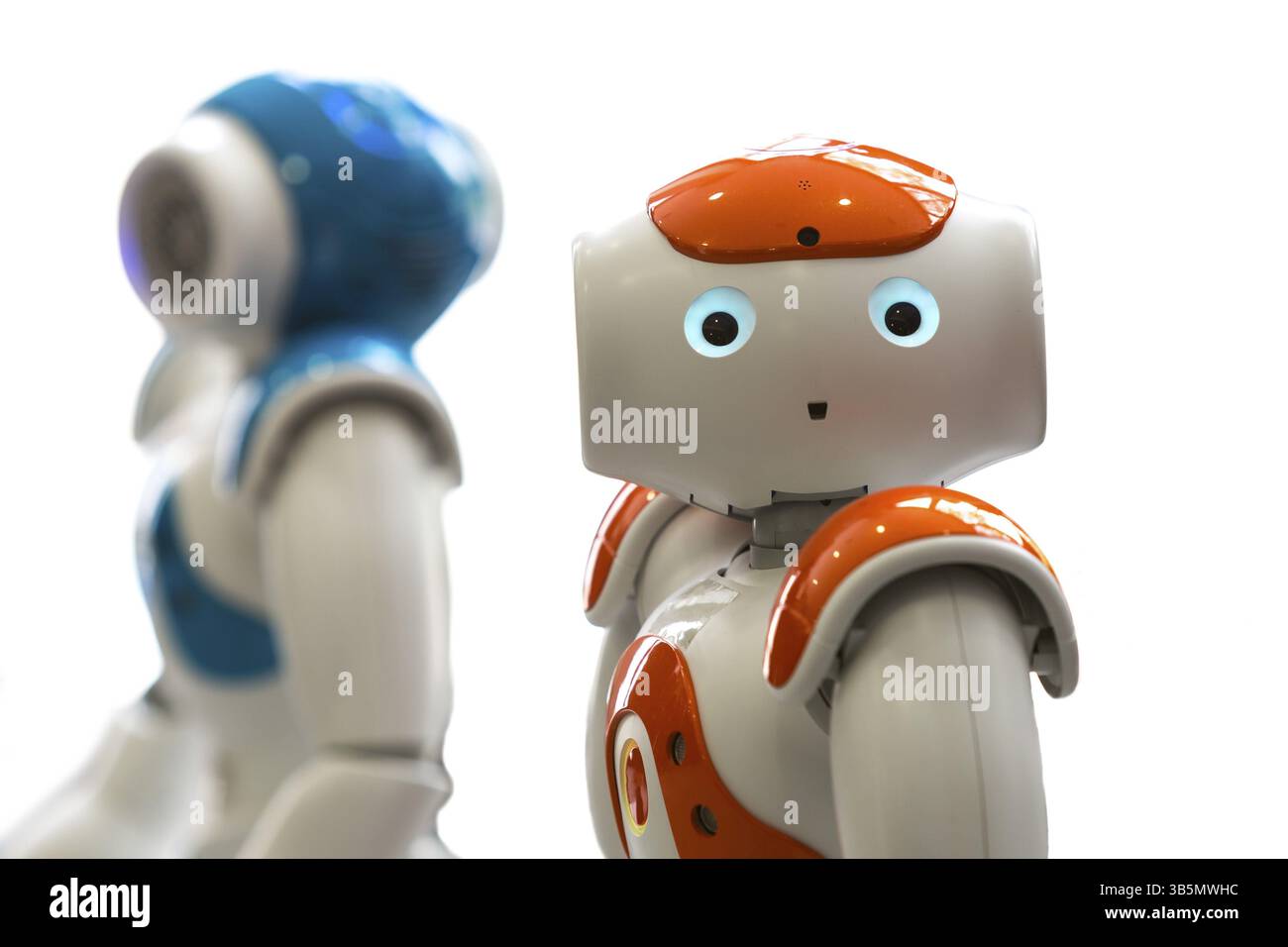 Small robots with human face and body - humanoid. Artificial ...