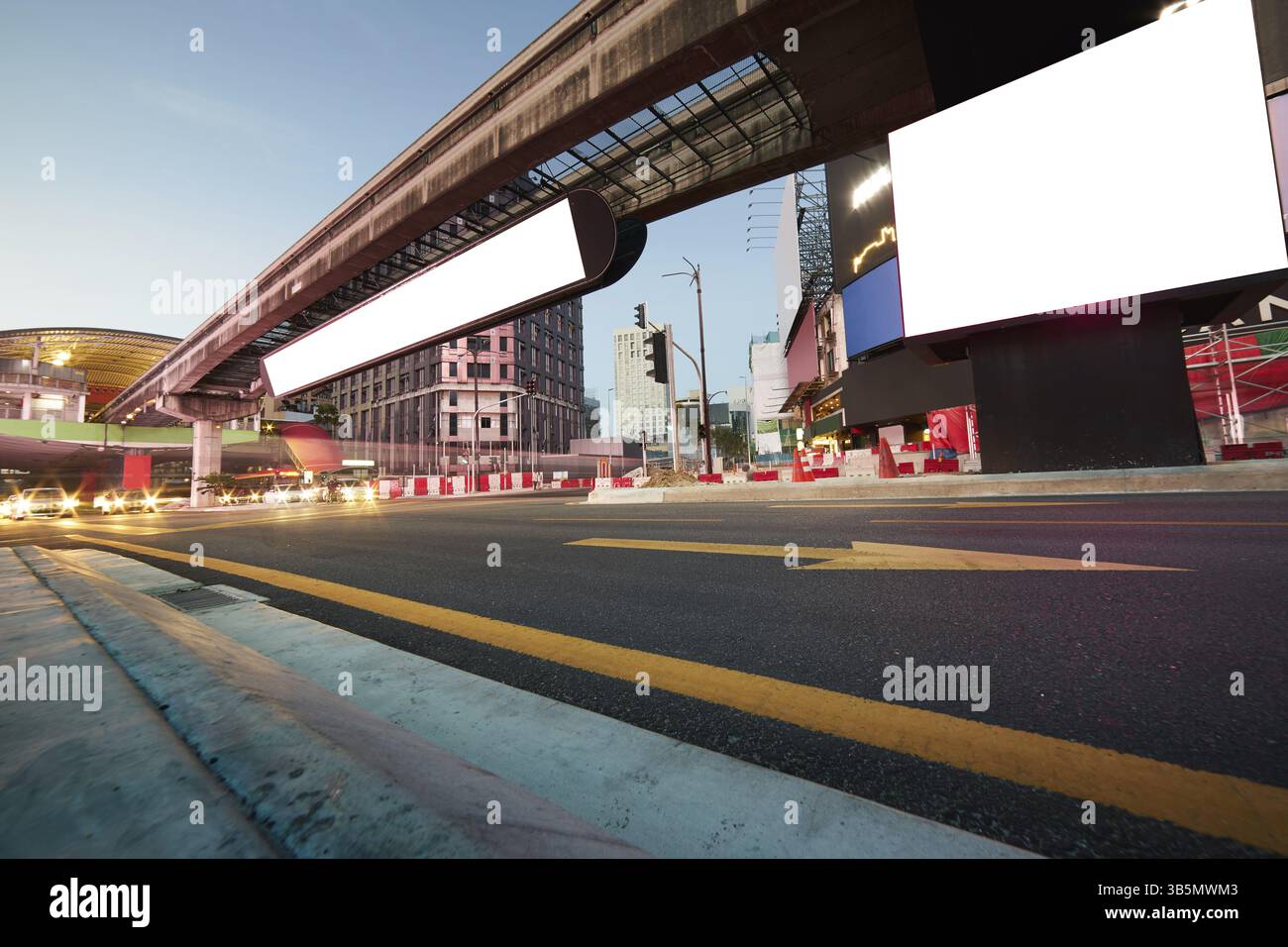 Empty asphalt road and modern buildings in Bukit Bintang District ...