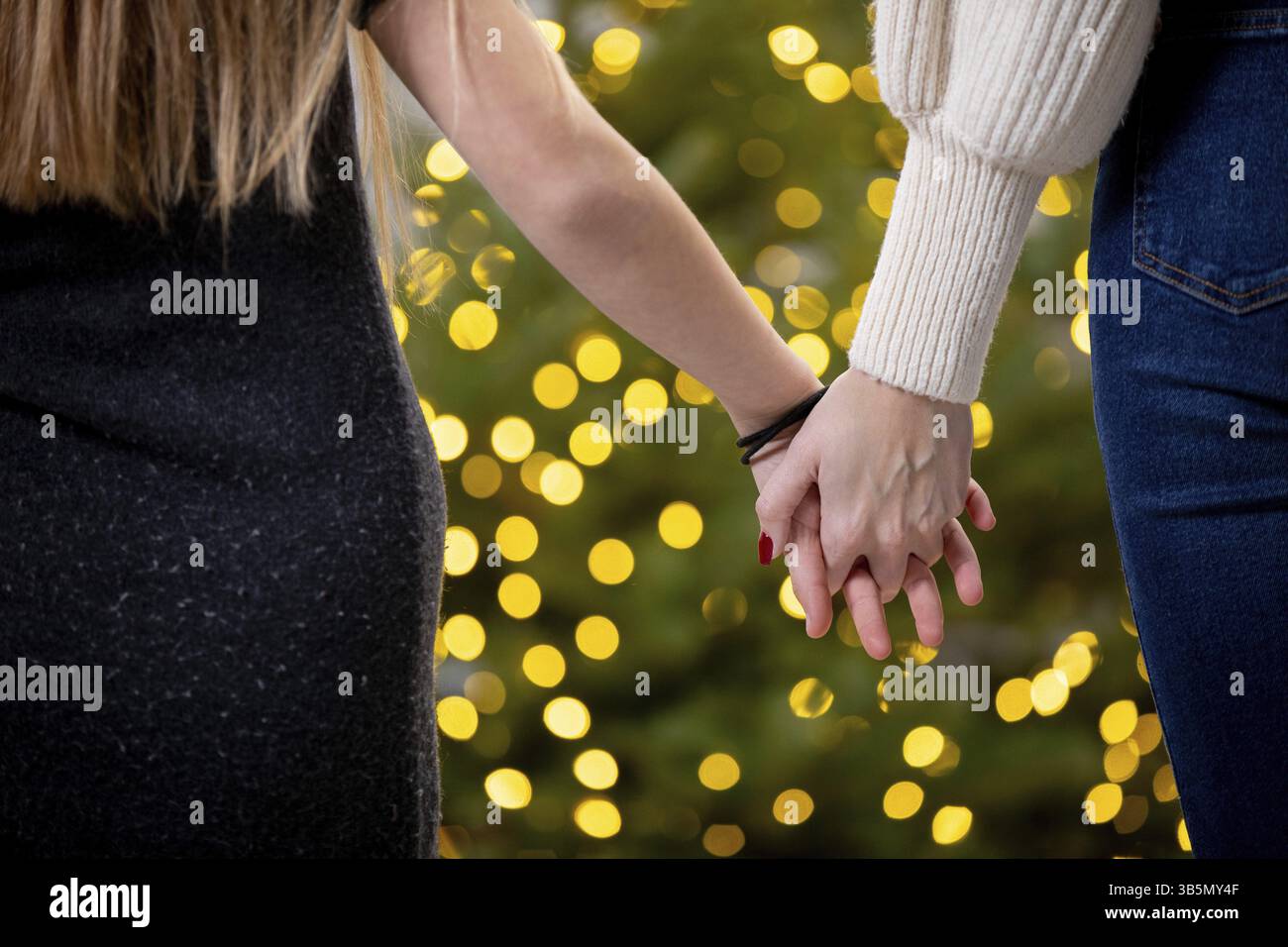 A warm and intimate moment shared between two people gently holding ...