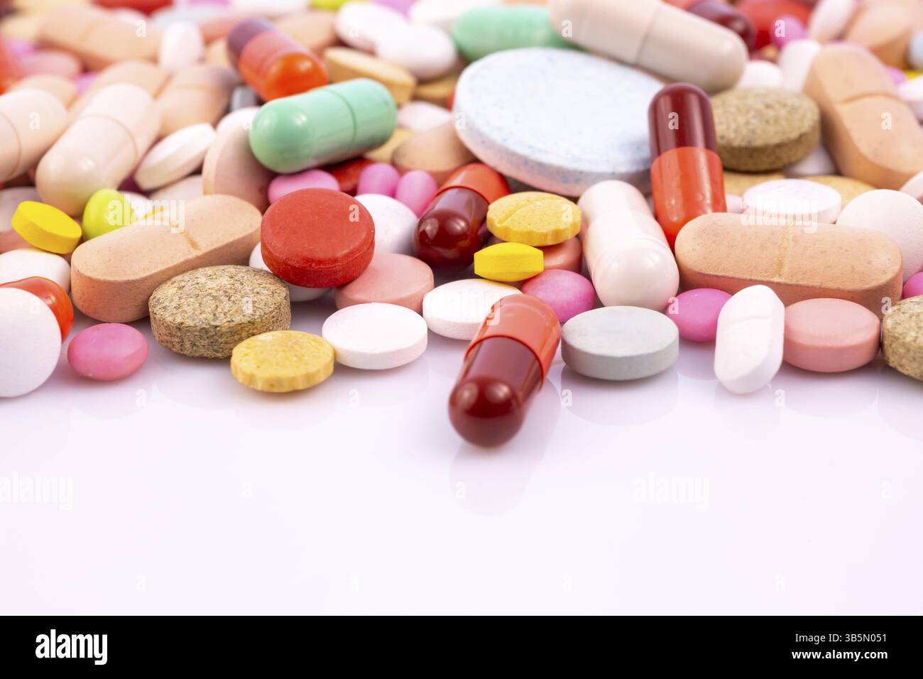 Different colorful pills and capsules. Global pharmaceutical industry ...