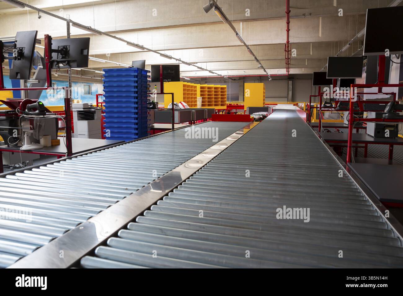 Empty conveyor sorting belt at distribution warehouse. Distribution hub ...
