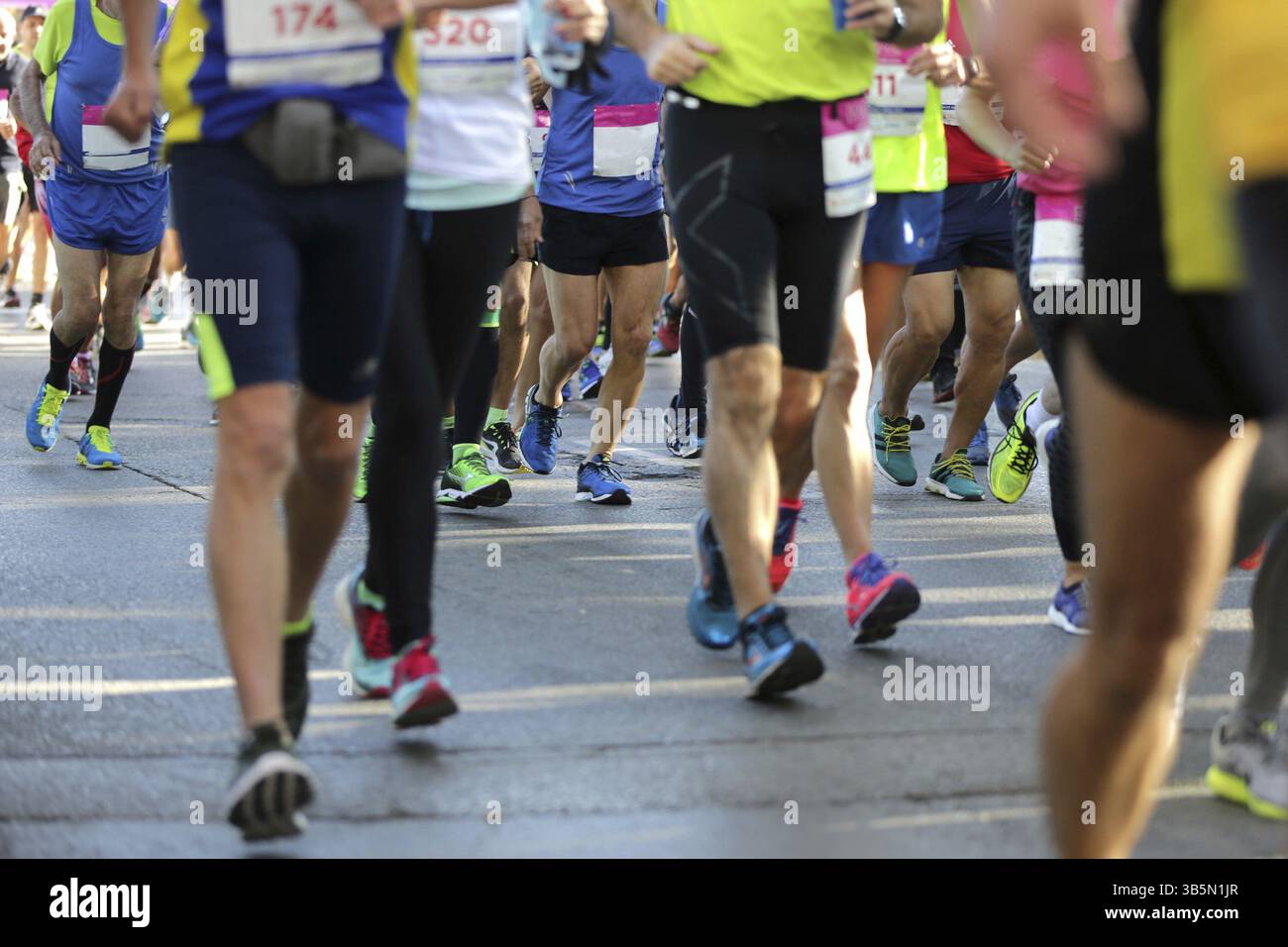Marathon running race. Legs and bodies only. Unrecognizable people. The ...