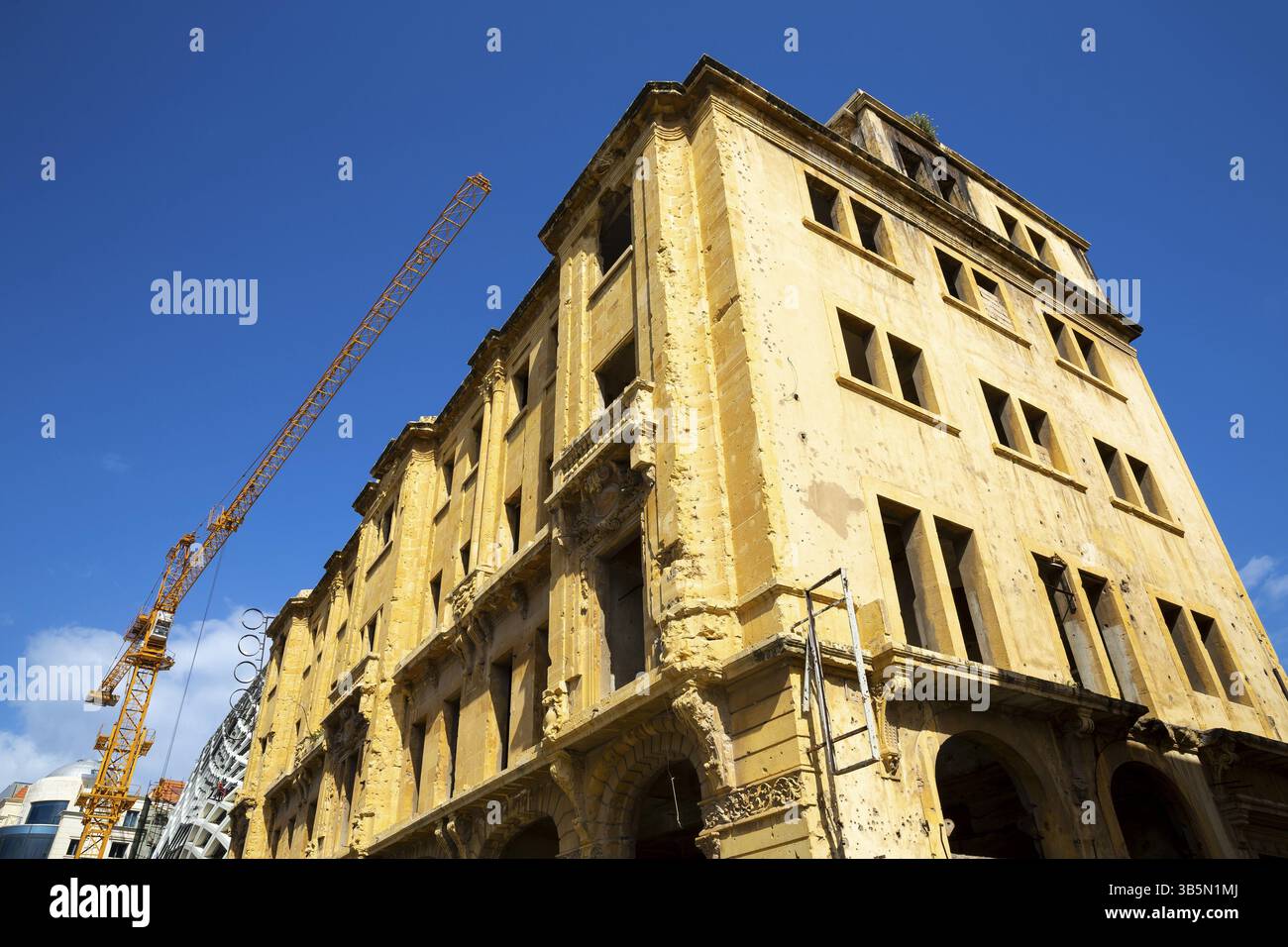 Cityscape of Beirut, Lebanon during daytime. A building with gun shots ...