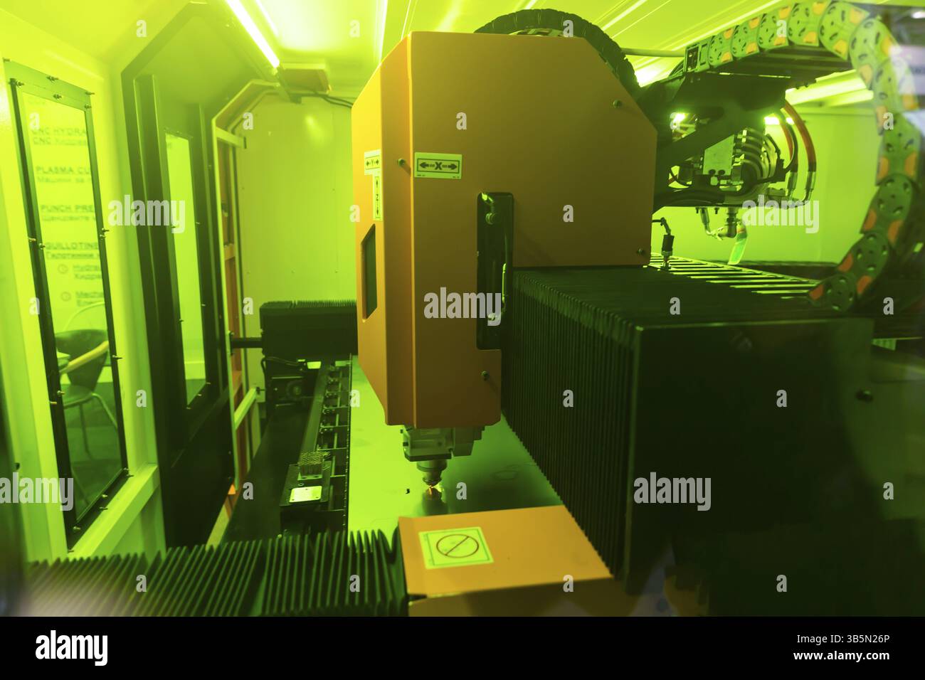 High precision CNC laser cutting elements out of a metal sheet ...