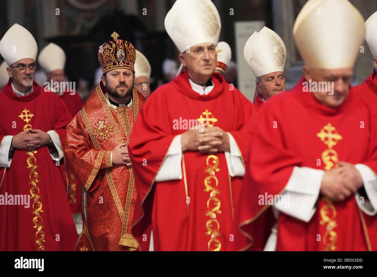 Cardinal Mykola Bychok, second from left, arrives in procession for a ...