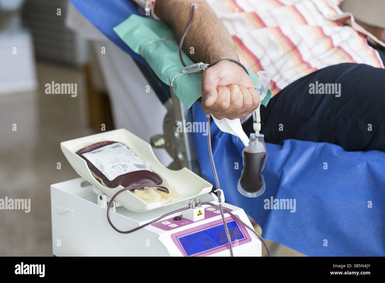 Volunteers are donating blood at the World Blood Donor Day (WBDD). The ...