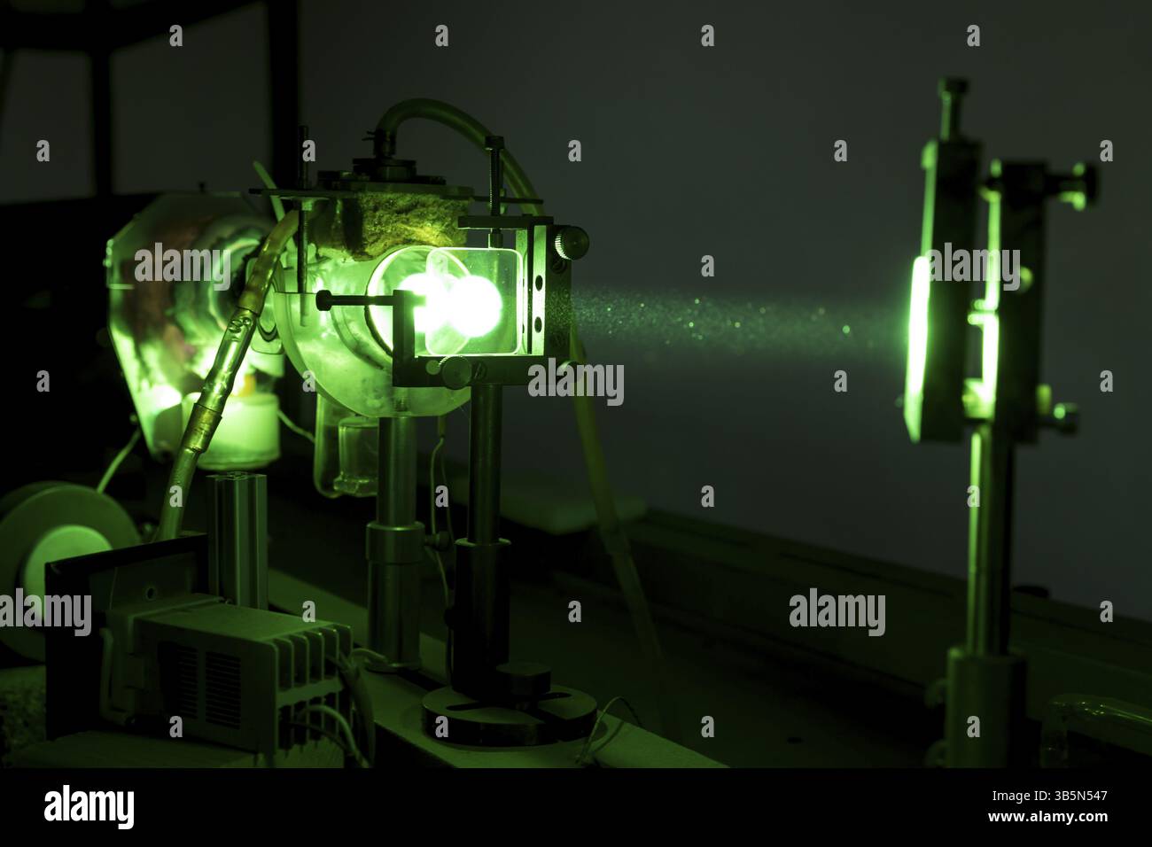 Powerful industrial green laser equipment in a laboratory for physics research. Solid State ...