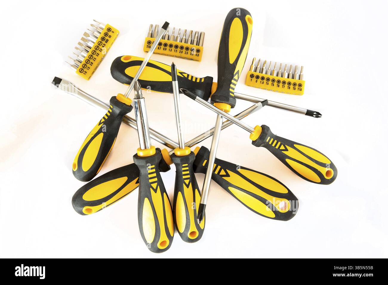 Set of screwdrivers with rubber black and yellow handles isolated on a ...