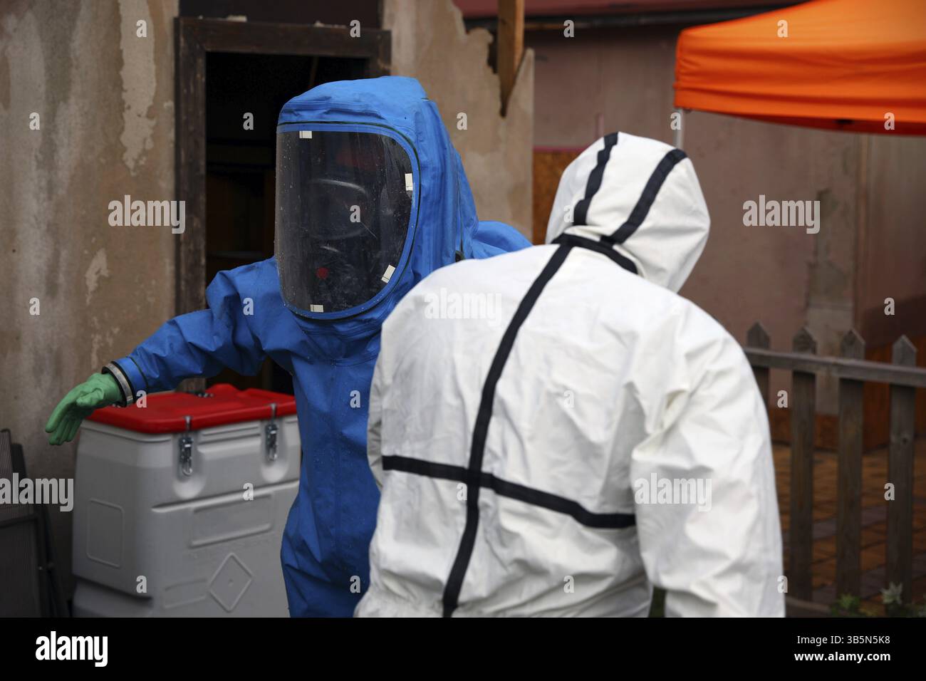 People wear Personal protective equipment (PPE) with gas mask for ...