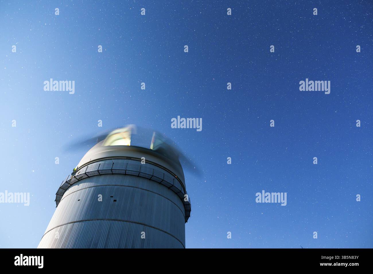 Rozhen astronomical observatory under the night sky stars. Blue sky ...