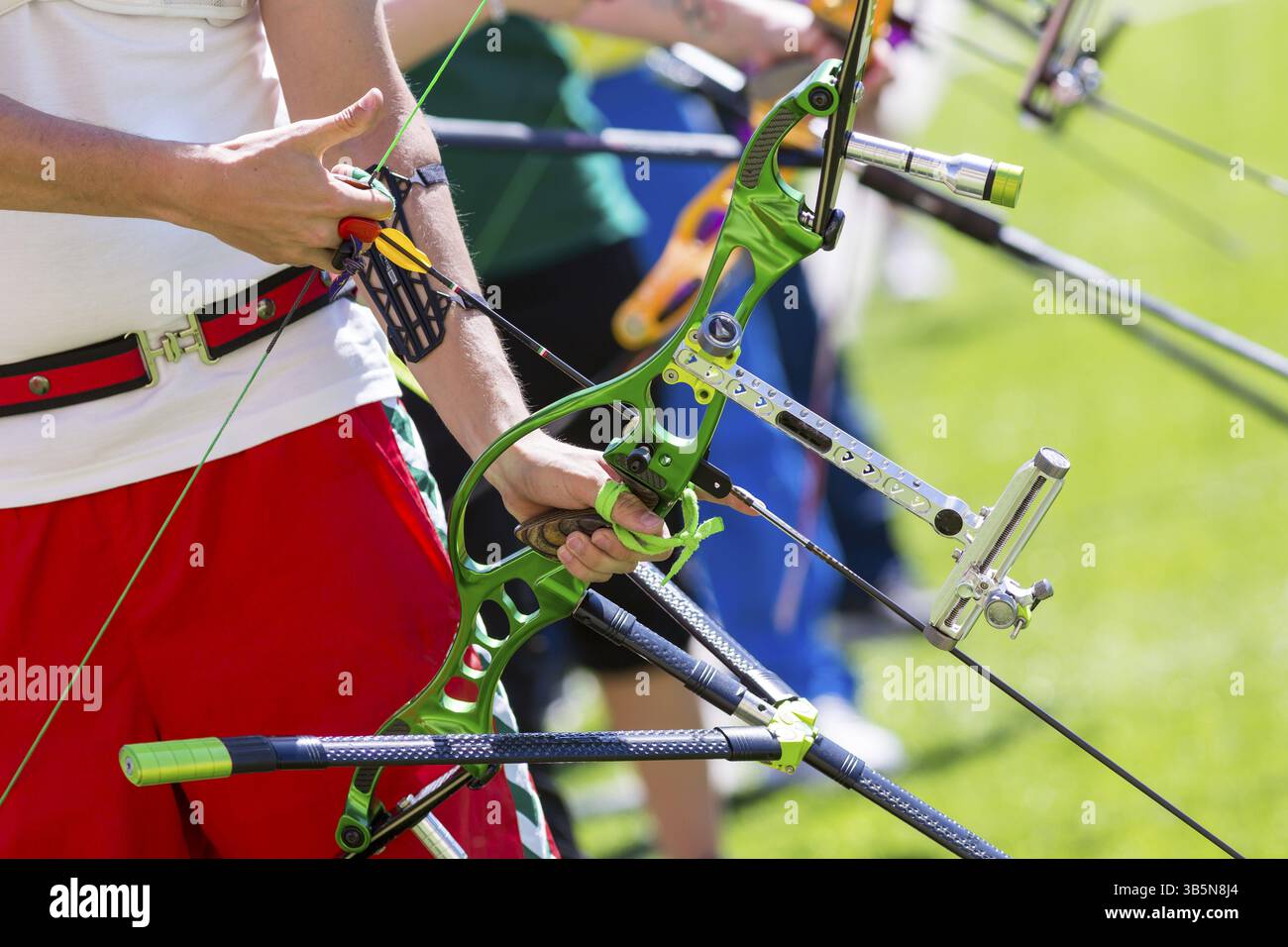 People are shooting with recurve bows during an archery competition ...