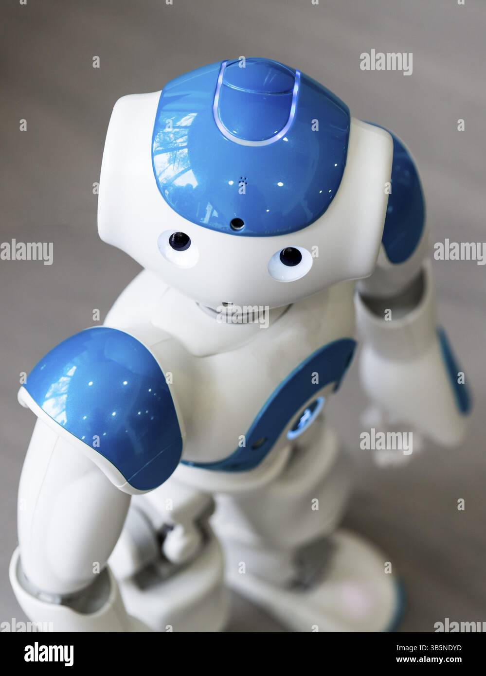 A small robot with human face and body - humanoid. Artificial ...