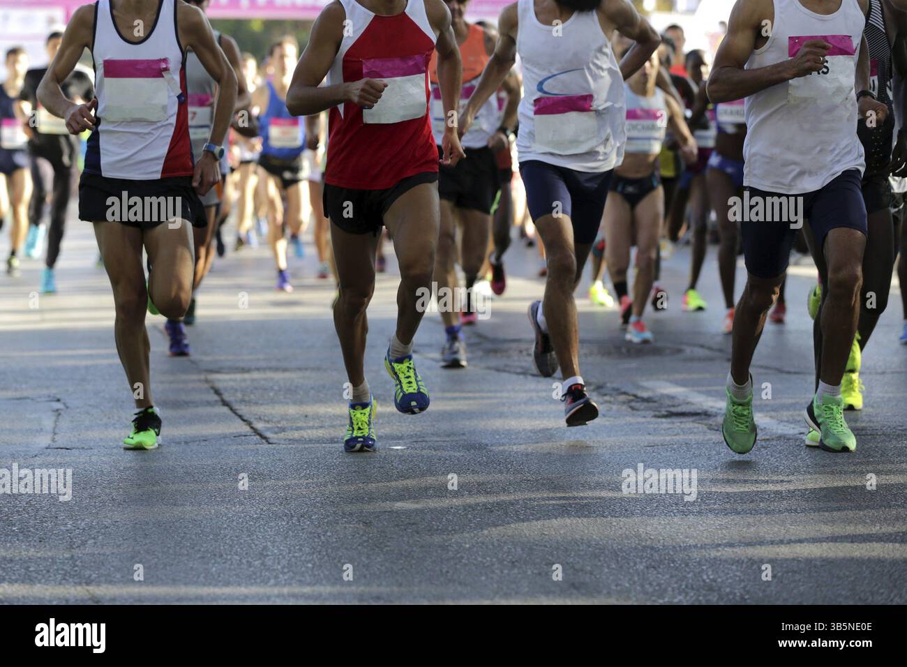 Marathon running race. Legs and bodies only. Unrecognizable people. The ...