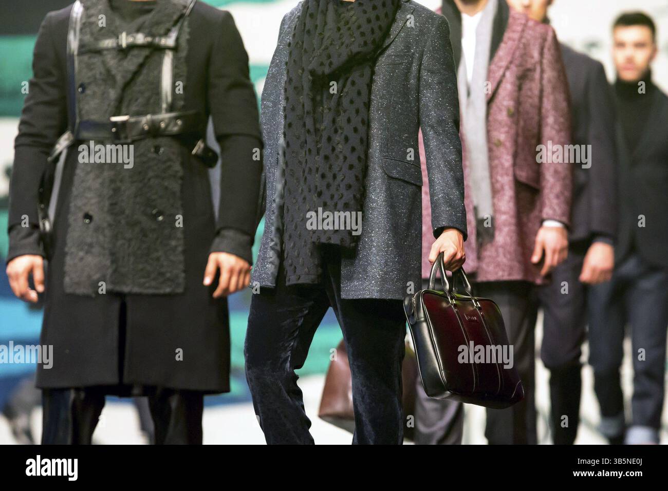 Men models walk the runway during a Fashion Show. Fashion catwalk event ...