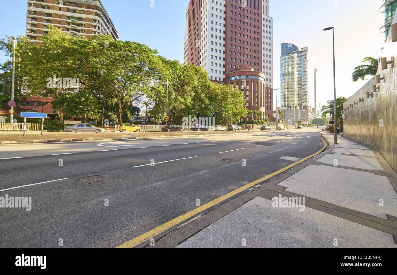 Empty asphalt road and modern buildings in Kuala Lumpur, Malaysia, Asia ...