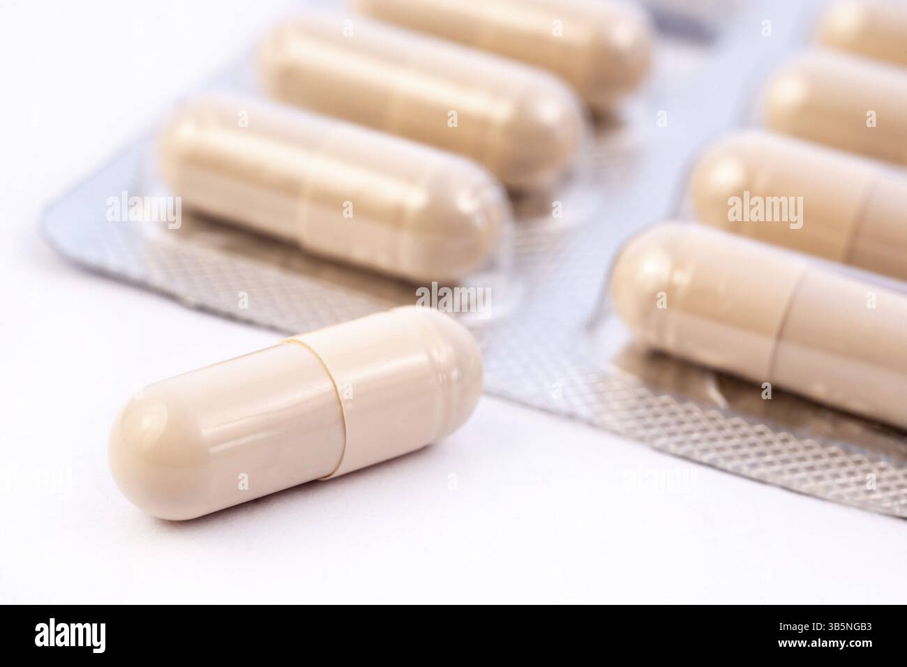 Beige capsules in silver plastic pack - blister. Global pharmaceutical ...