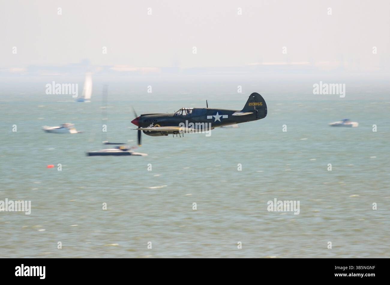 Curtiss P-40 Kittyhawk WWII plane G-KITT of Hangar 11 flying at the ...