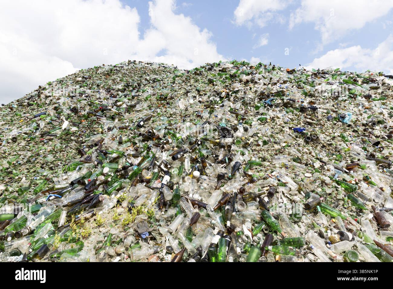 Glass waste for recycling in a recycling facility. Different glass ...