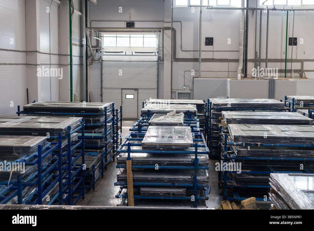 Pvc windows wrapped in protective film waiting for installation in ...