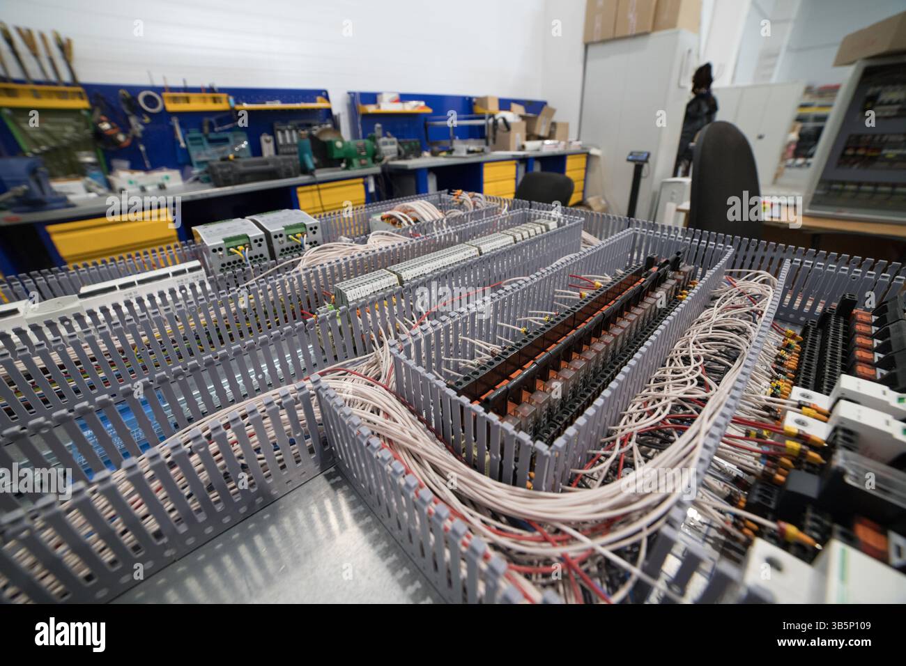 Electrical cabinet under assembly showing relays, wires and terminals ...