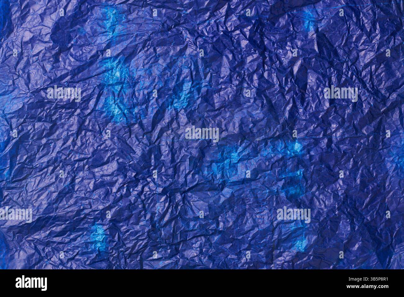 crumpled used blue carbon paper surface background, navy blue tone waxy ...