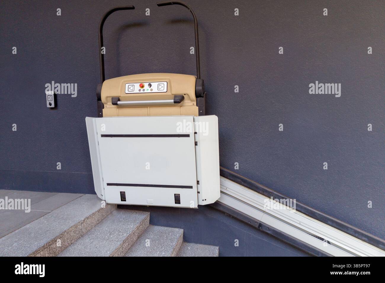 Wheelchair Platform Lift on Modern Staircase Stock Photo - Alamy
