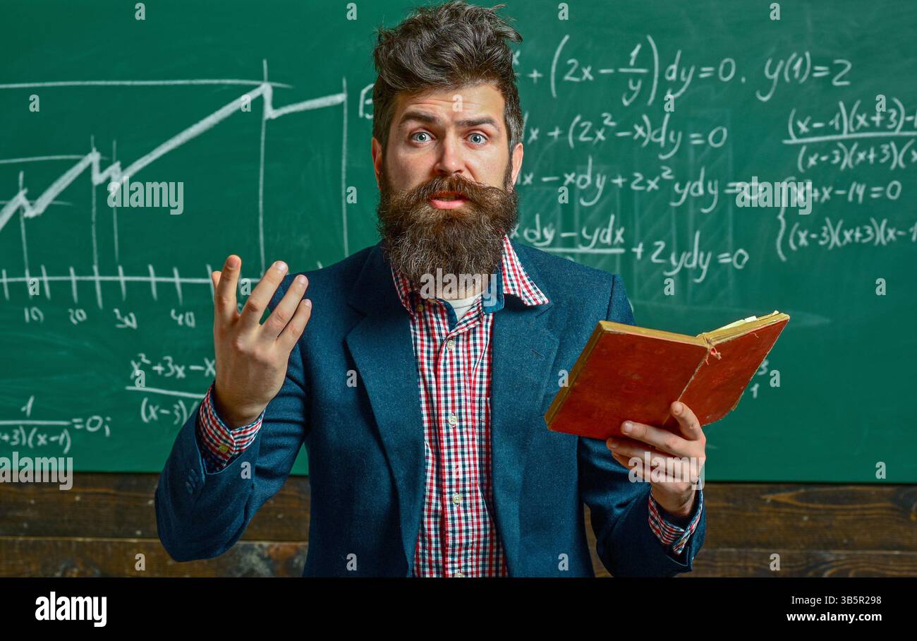 Teacher explains math in class. Professor in classroom on math lesson ...