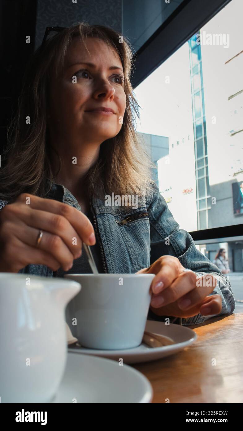 Beautiful woman drinking coffee in cafe. Daily life concept. Enjoy your ...