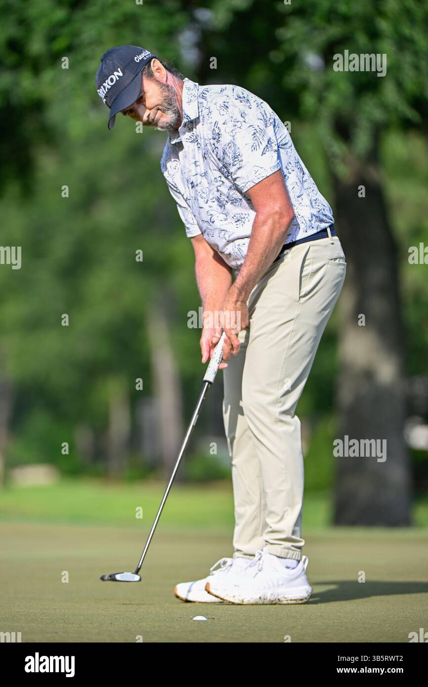THE WOODLANDS, TX - MAY 02: Mark Hensby sinks his birdie putt on 1 ...
