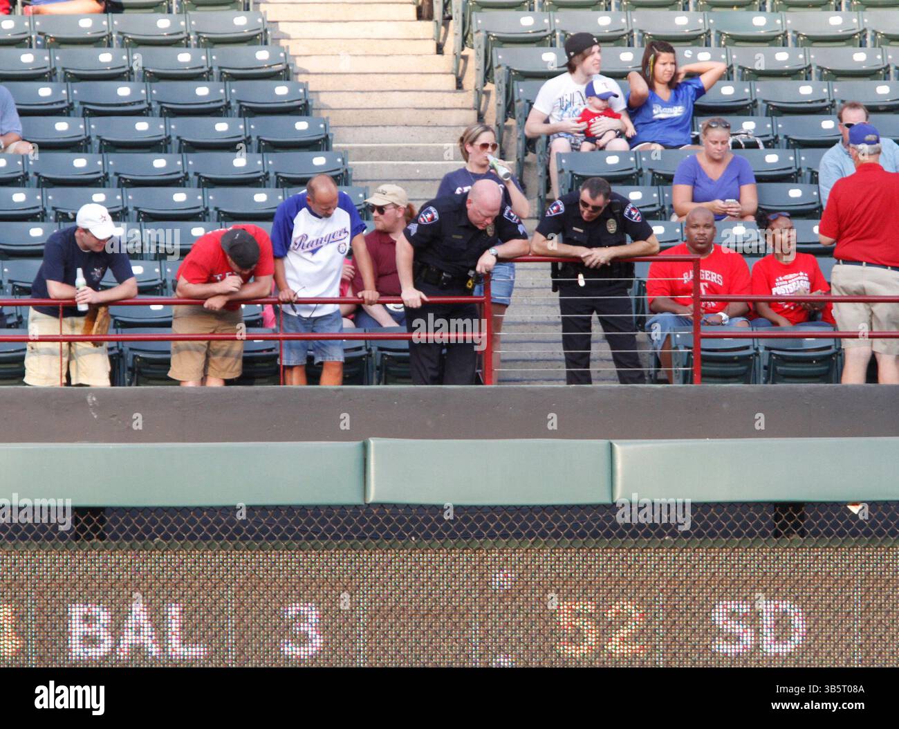 FILE - Police and fans look over the railing where a fan fell from the ...