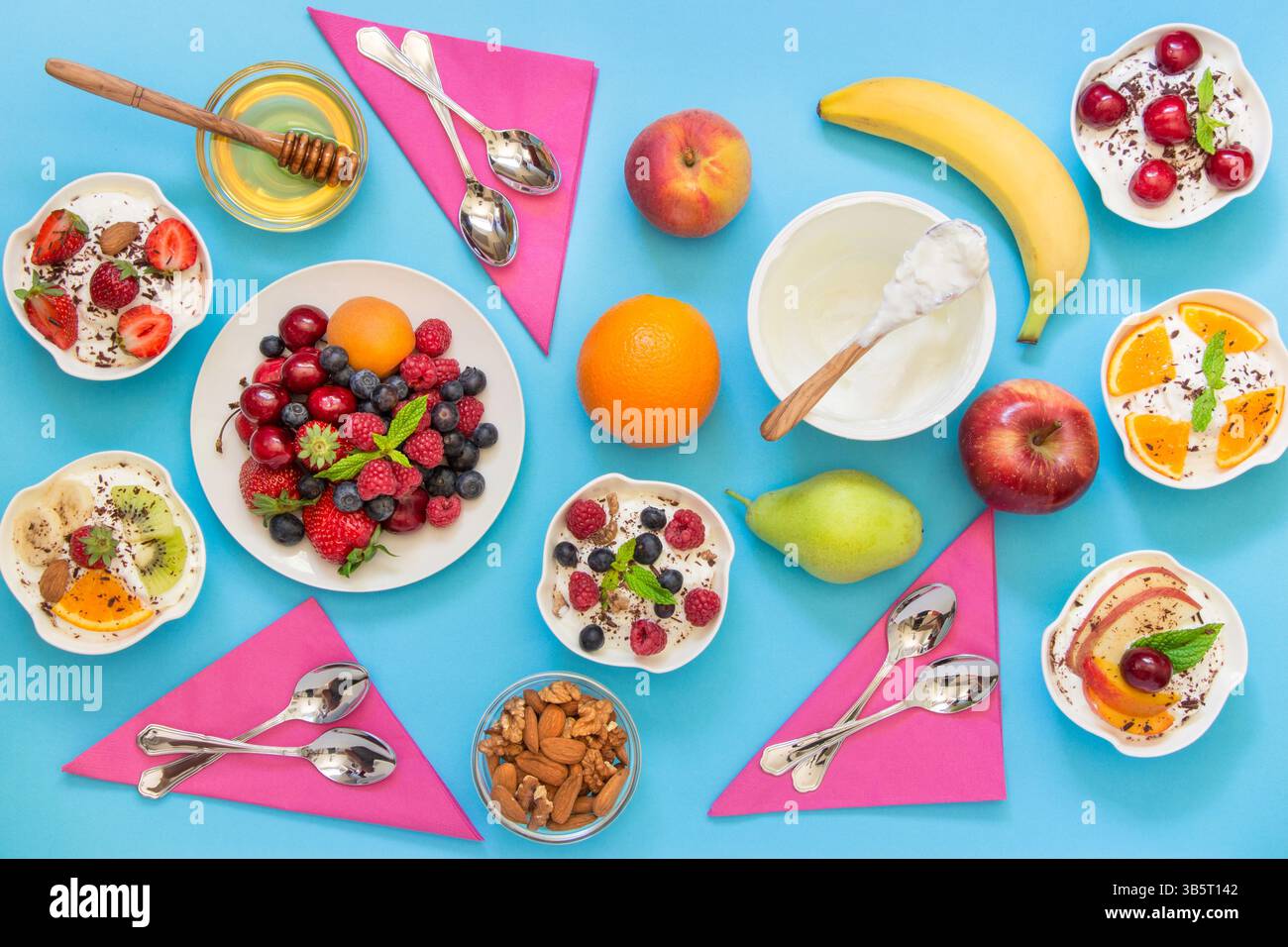 6 bowls of yogurt dressed with different ingredients fruit, berries ...