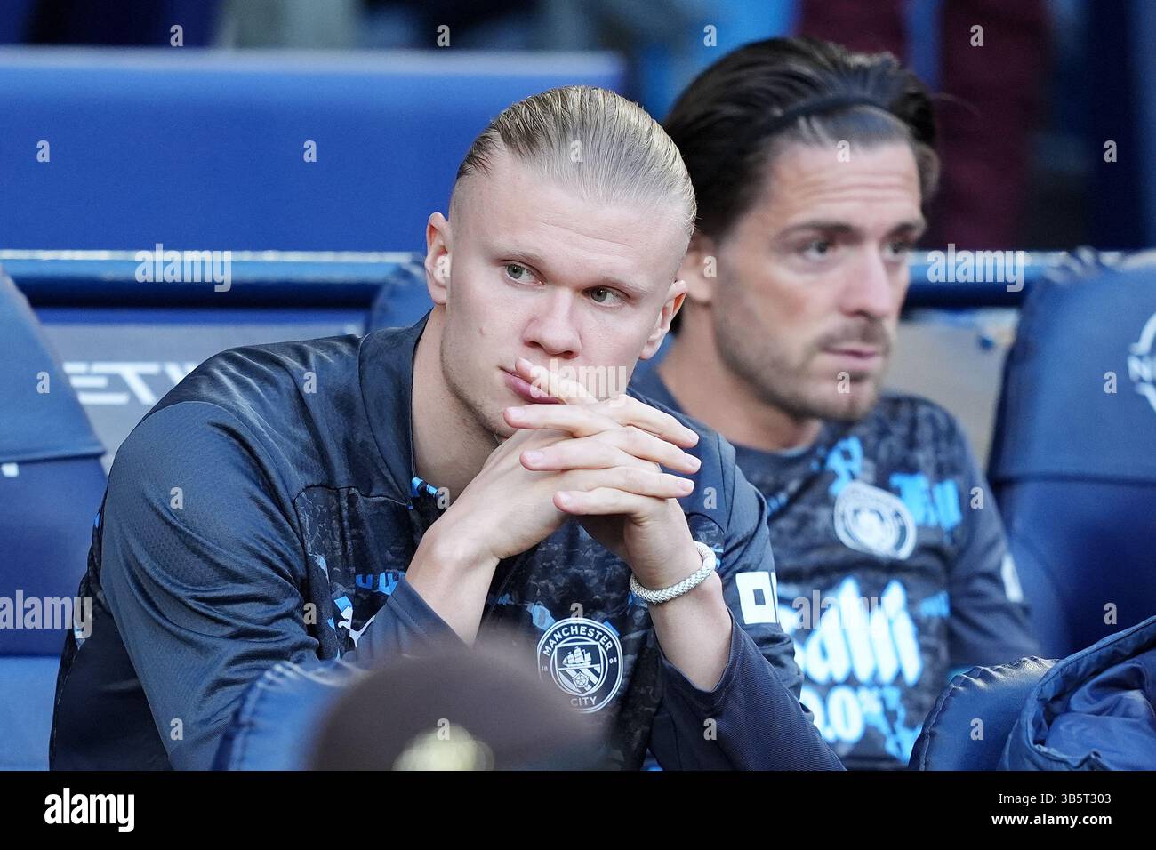 Manchester City's Erling Haaland (left) and Jack Grealish on the ...