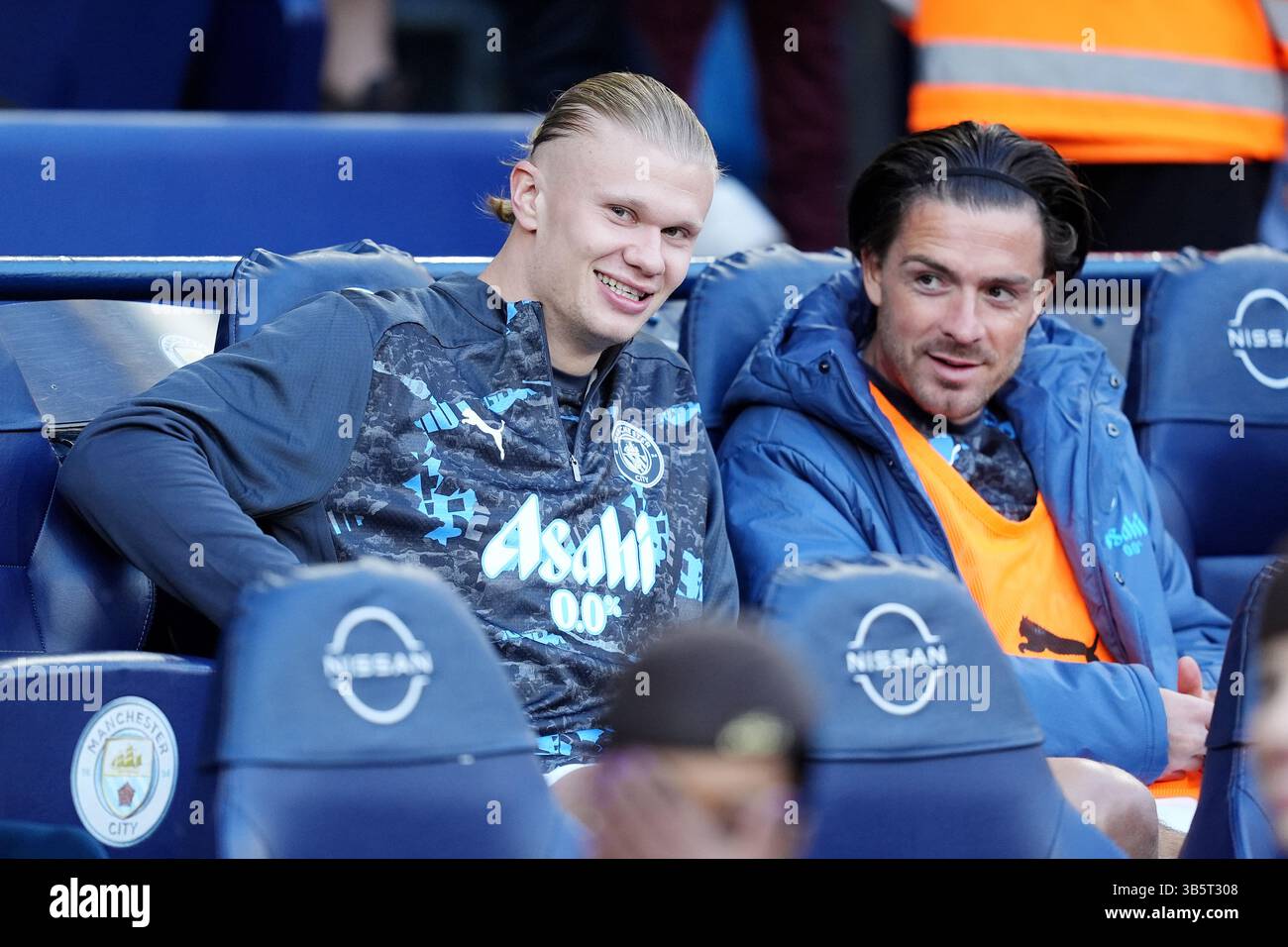 Manchester City's Erling Haaland (left) and Jack Grealish on the ...
