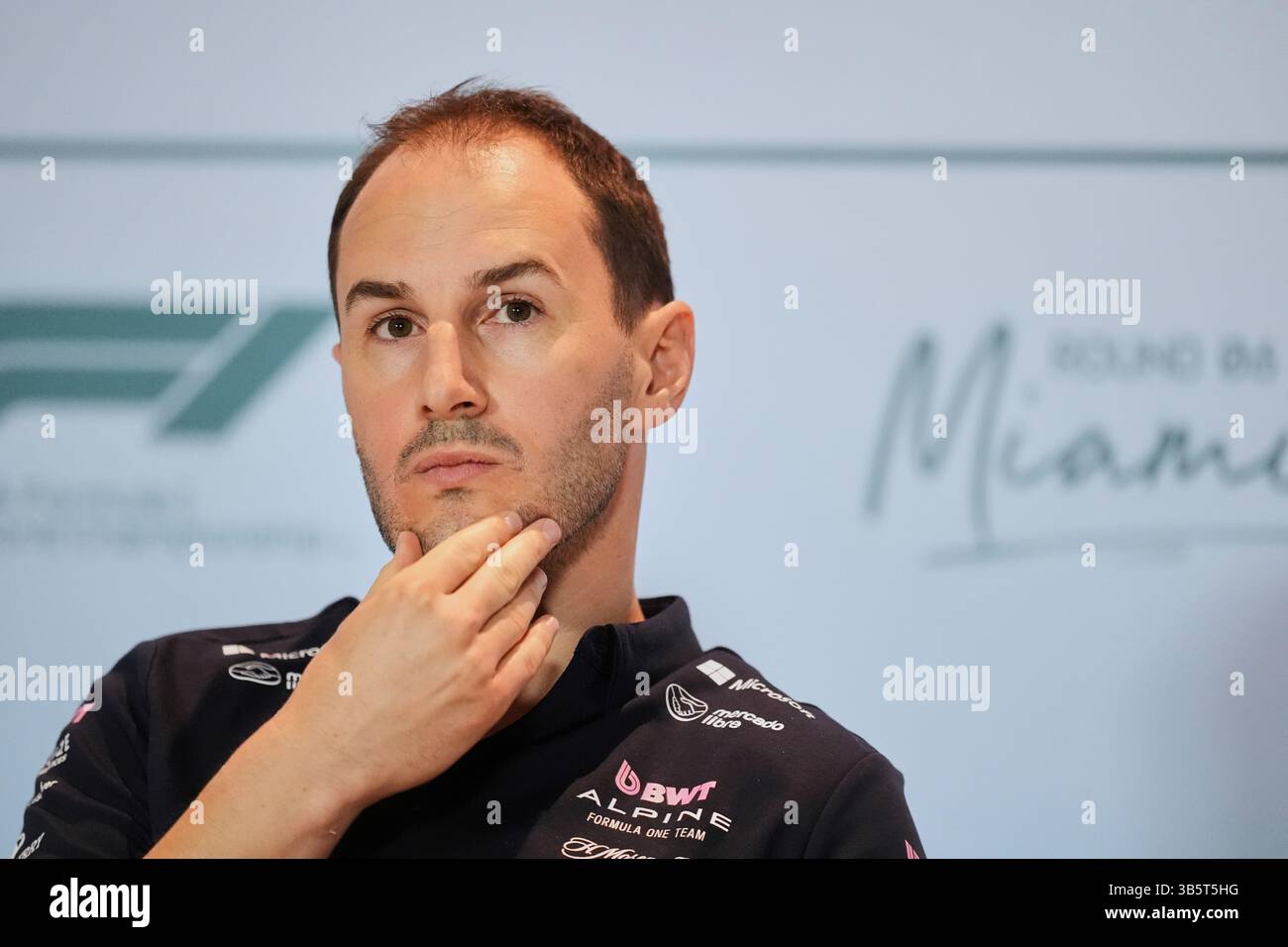 Alpine principal Oliver Oakes listens to reporters during a press ...