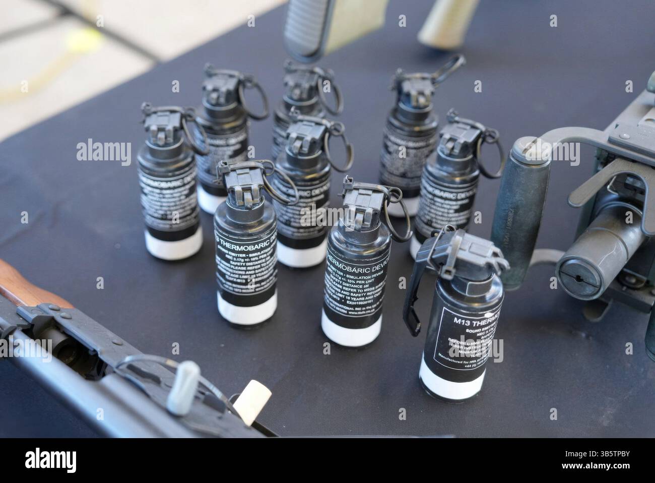 Seized weapons and other munitions sit on display during a press ...