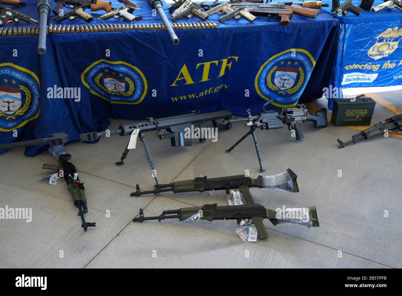 Seized weapons and other munitions sit on display during a press ...